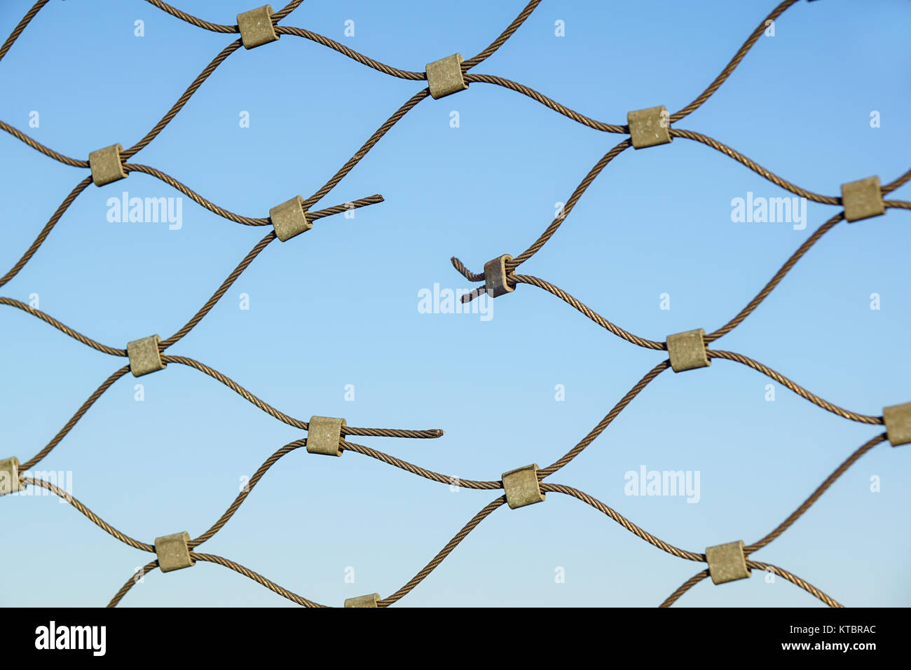 Metal wire fence protection chainlink background . hole Stock Photo - Alamy