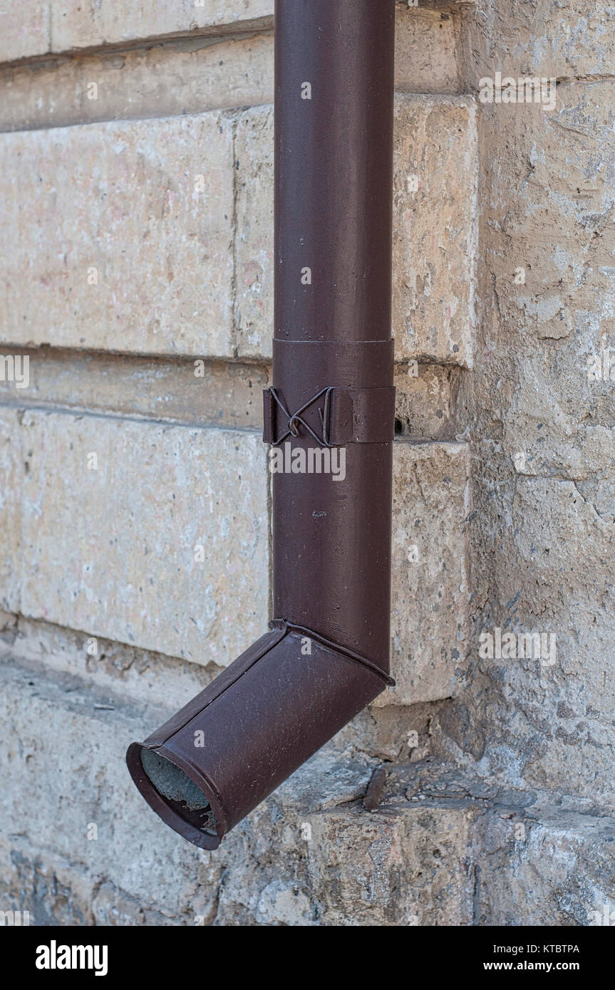 Metal brown pipe for a drain Stock Photo - Alamy