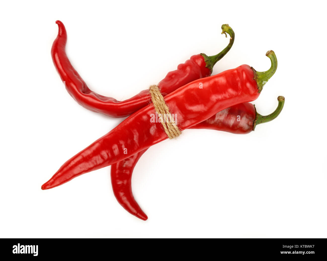 Bunch of red hot chili peppers isolated on white Stock Photo - Alamy