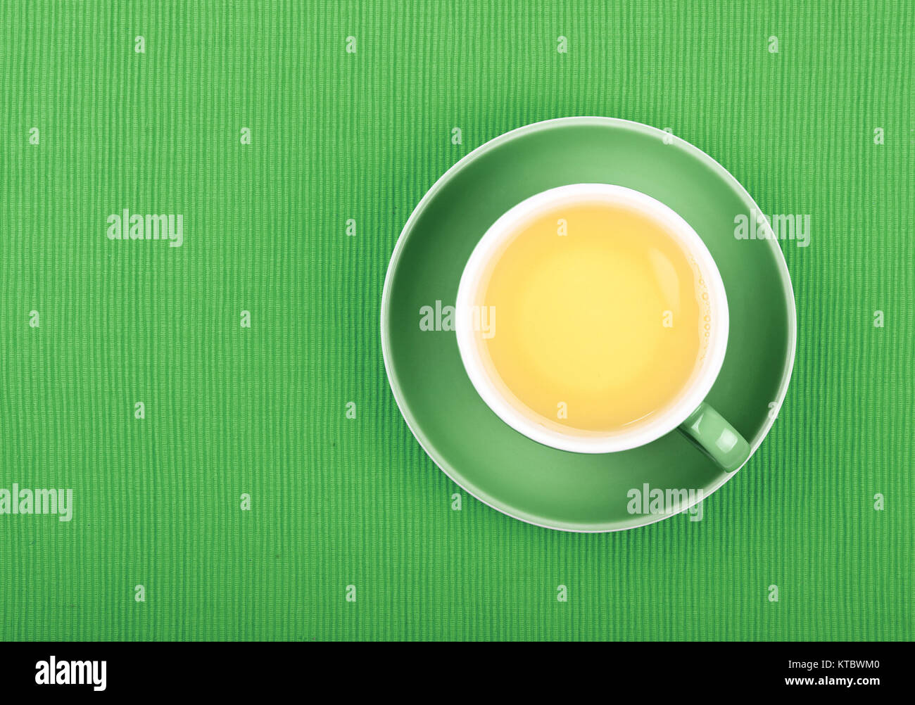 Full cup of green tea close up elevated top view Stock Photo - Alamy