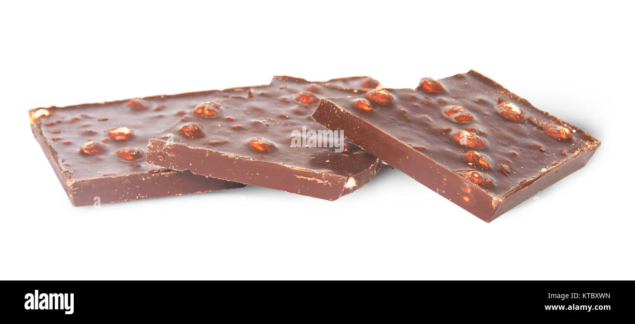 Several pieces of dark chocolate with hazelnuts Stock Photo - Alamy