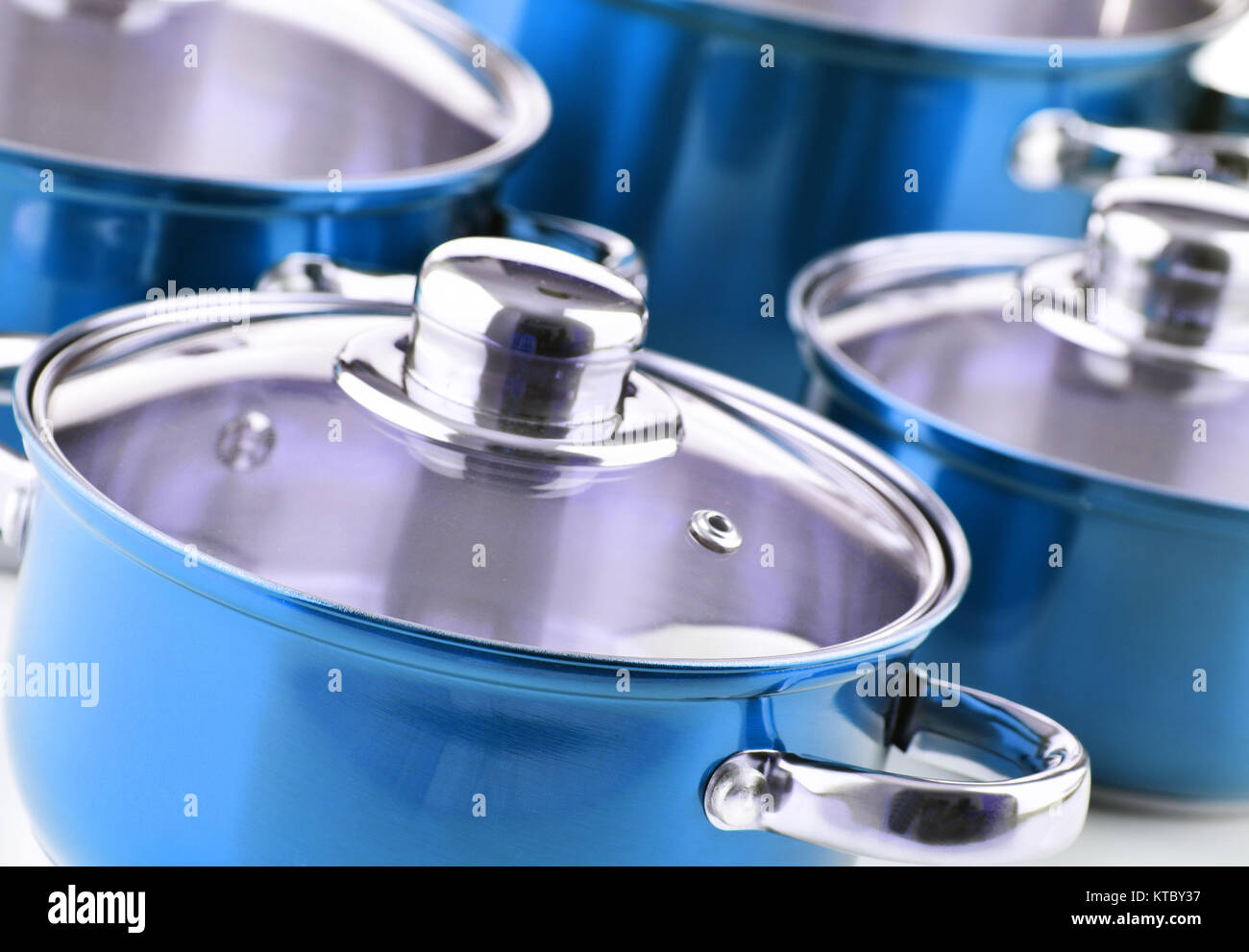 Composition with a set of steel pots Stock Photo - Alamy
