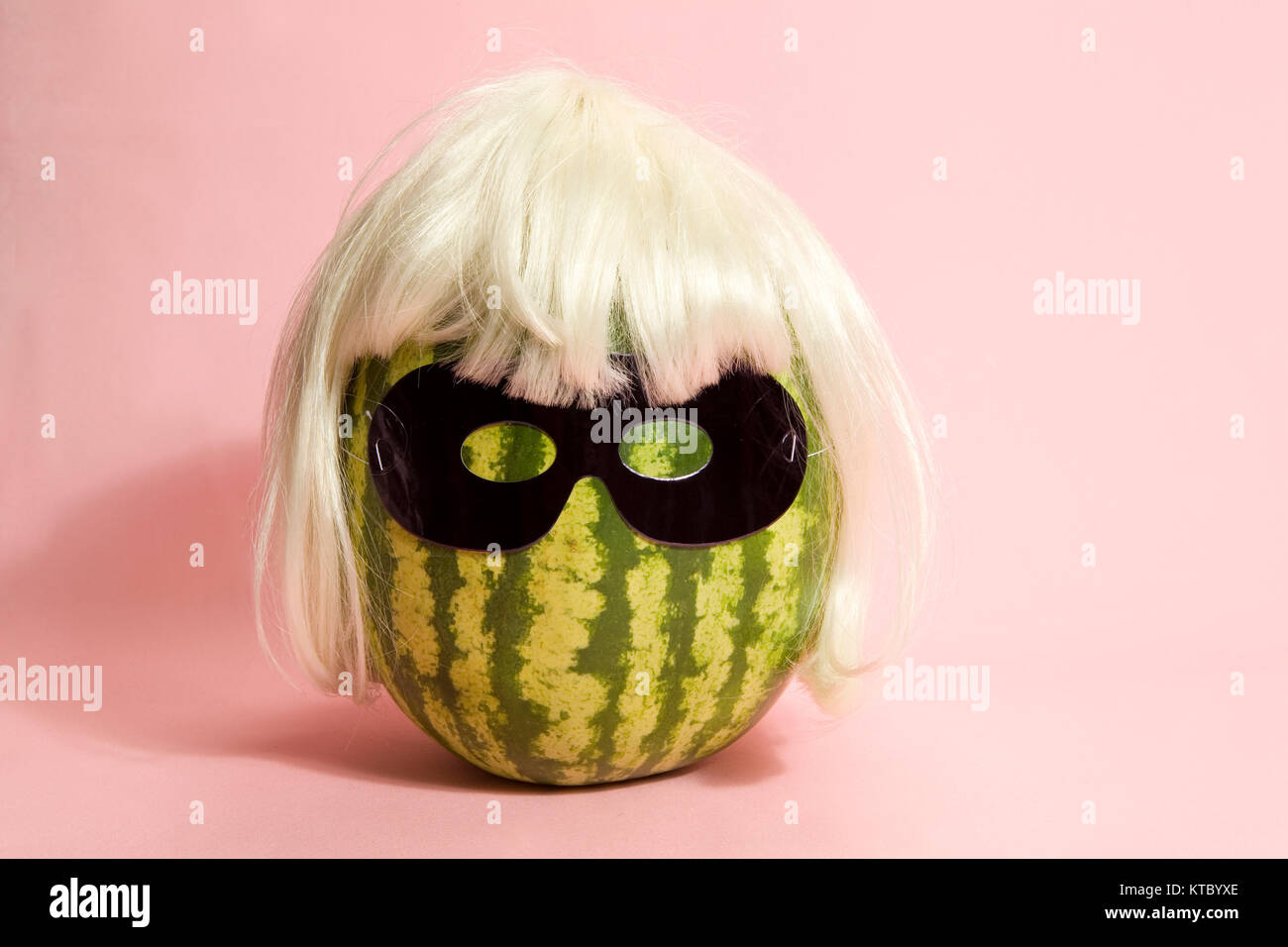 Superwatermelon wearing a black mask Stock Photo - Alamy