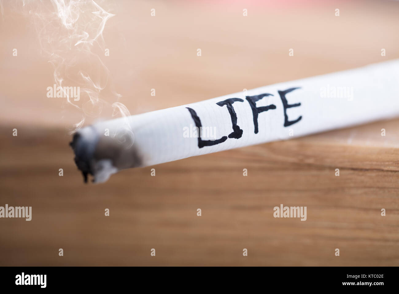 Life Word Written On Burning Cigarette Stock Photo - Alamy