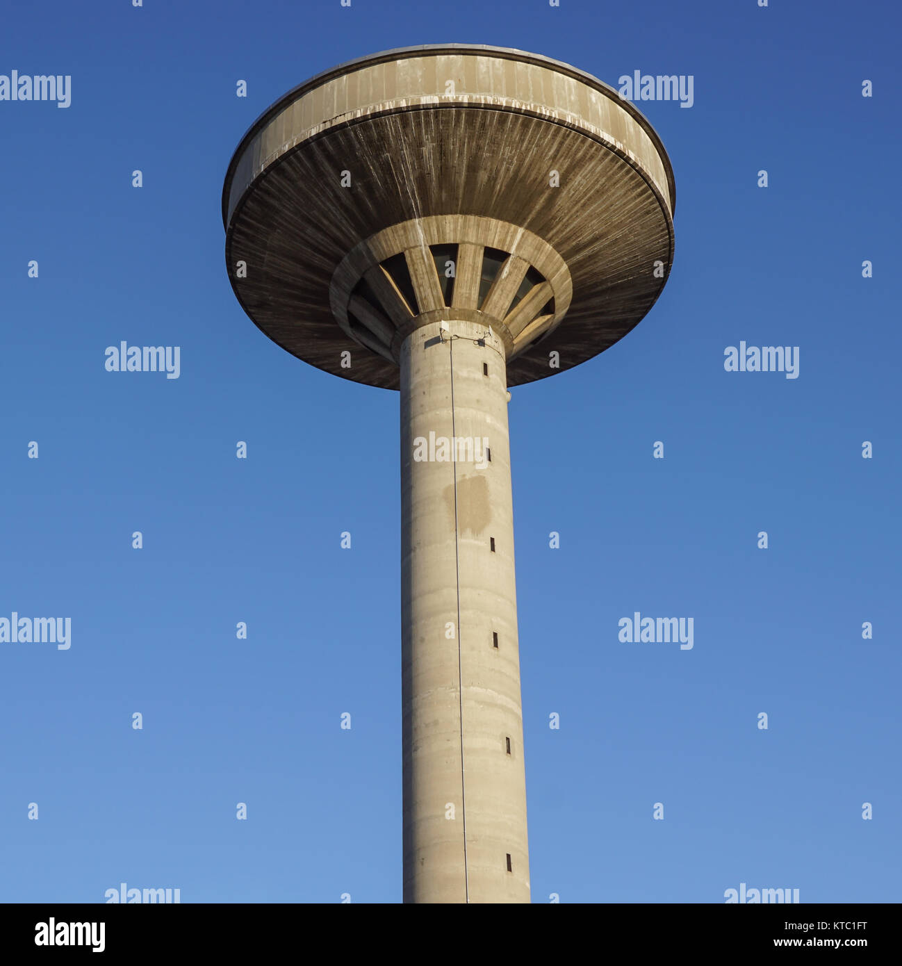 concrete tall water tower against blue sky Stock Photo - Alamy