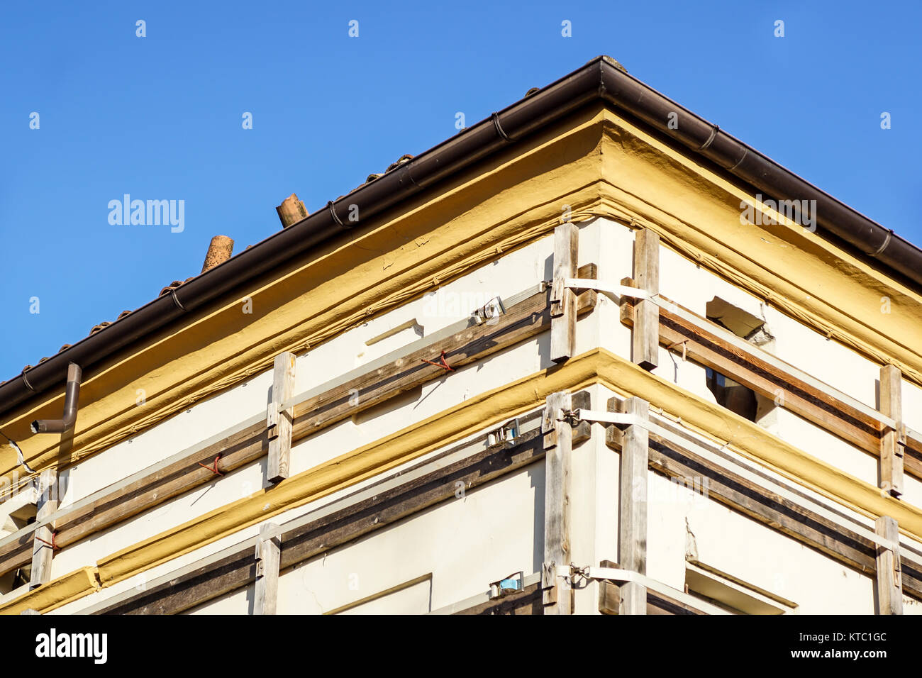 Facade of an old italian masonry building with metal tie-rod and anchor ...