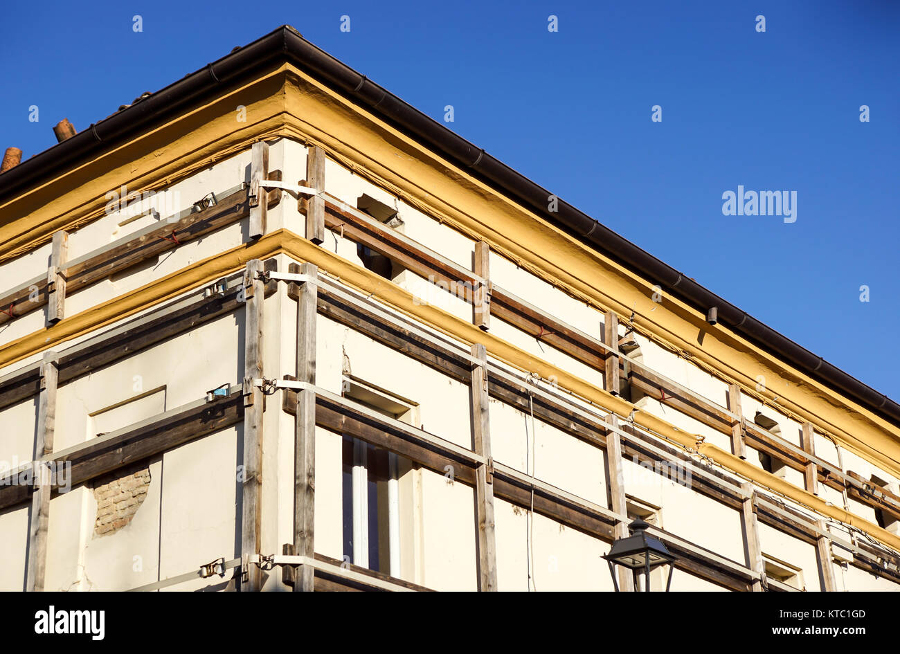 Facade of an old italian masonry building with metal tie-rod and anchor ...