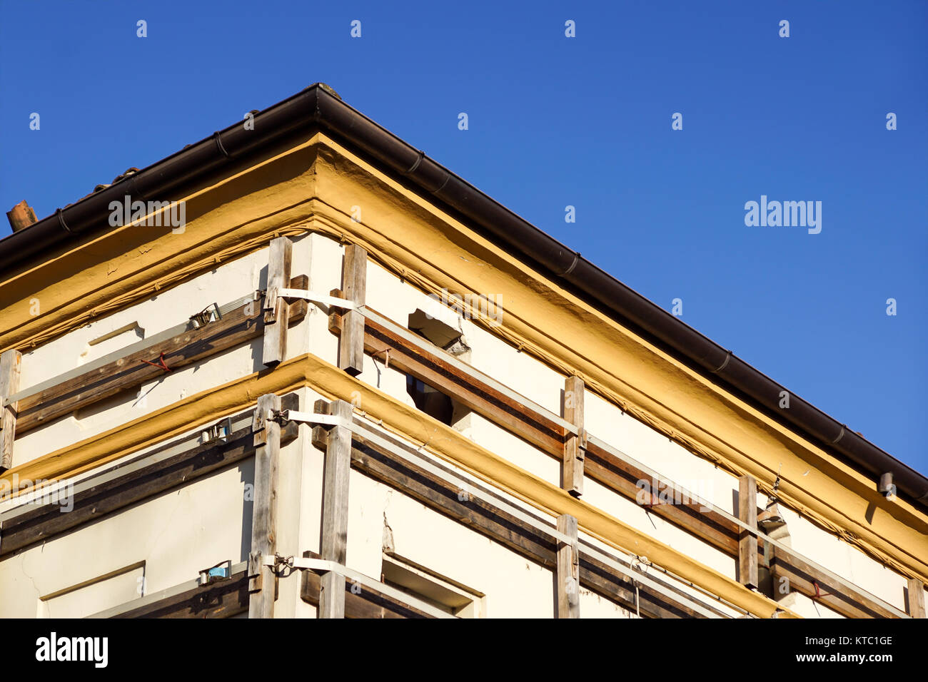Facade of an old italian masonry building with metal tie-rod and anchor ...