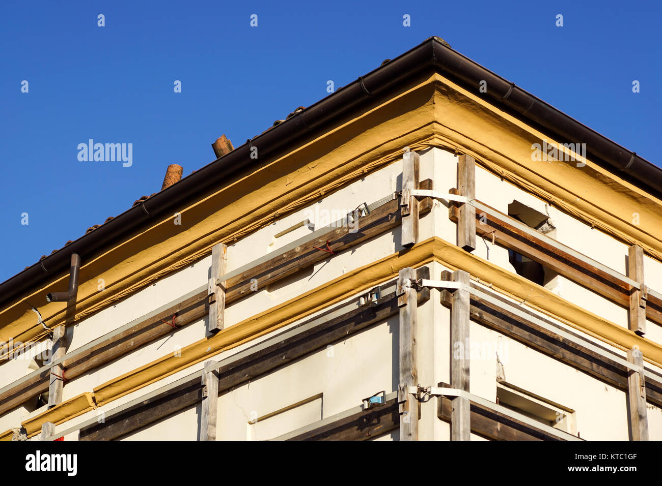 Facade of an old italian masonry building with metal tie-rod and anchor ...