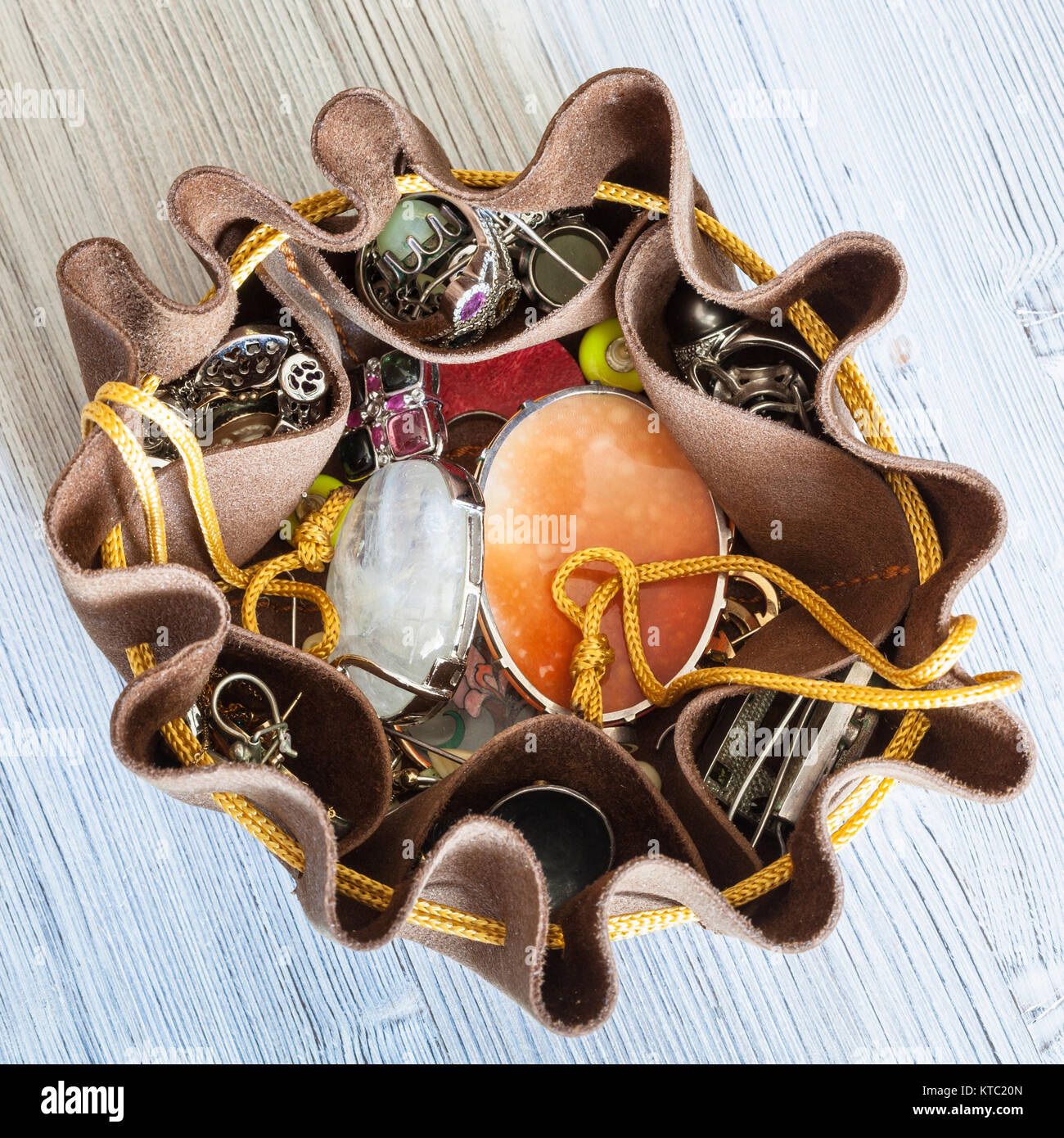 top view of open leather purse with jewelry Stock Photo - Alamy