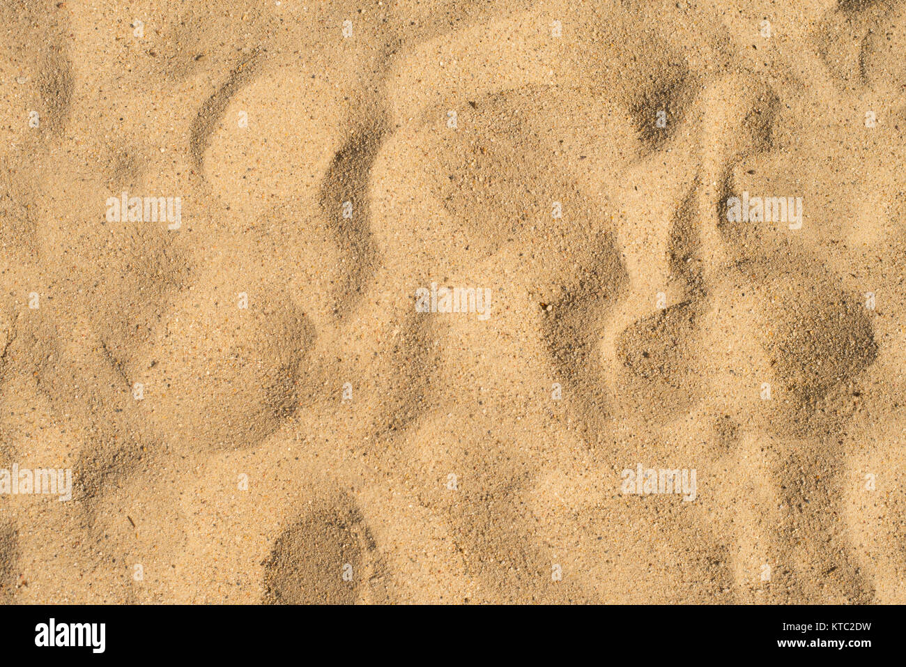 Close up on sand background or texture Stock Photo - Alamy