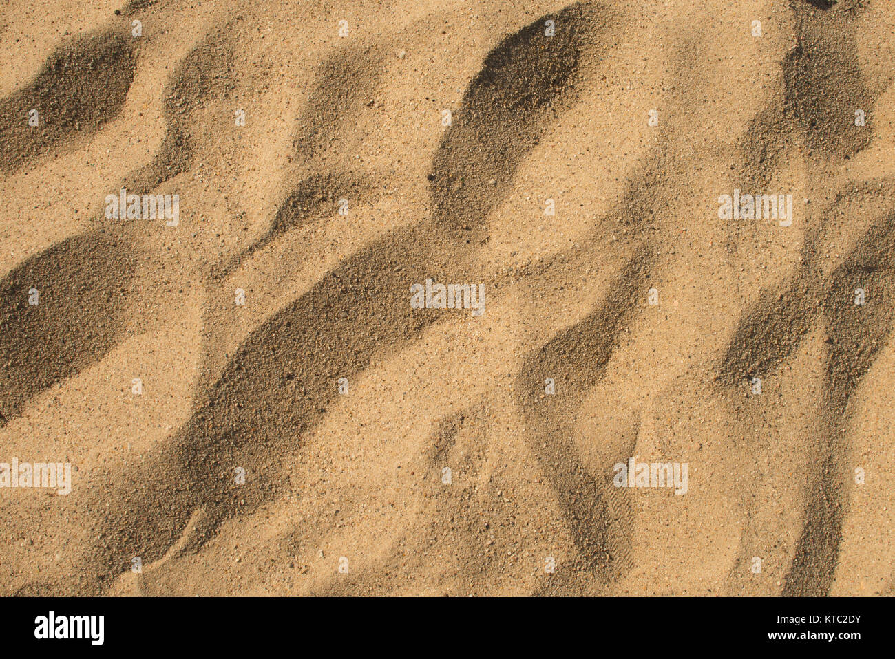 Close up on sand background or texture Stock Photo - Alamy
