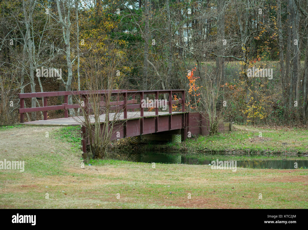 Old red wood bridge over water Stock Photo - Alamy
