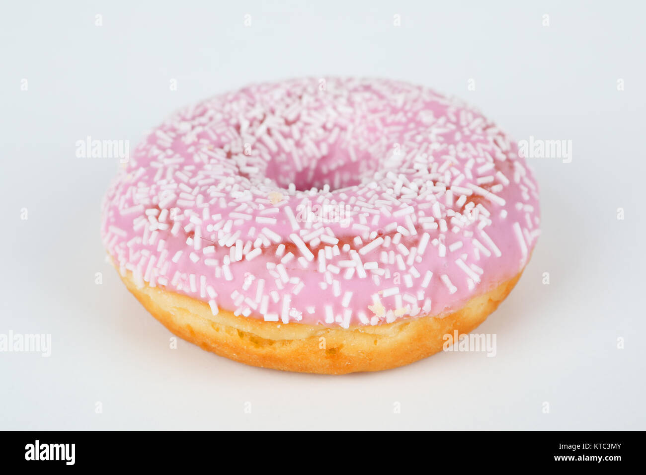 pink doughnut with sprinkles Stock Photo - Alamy