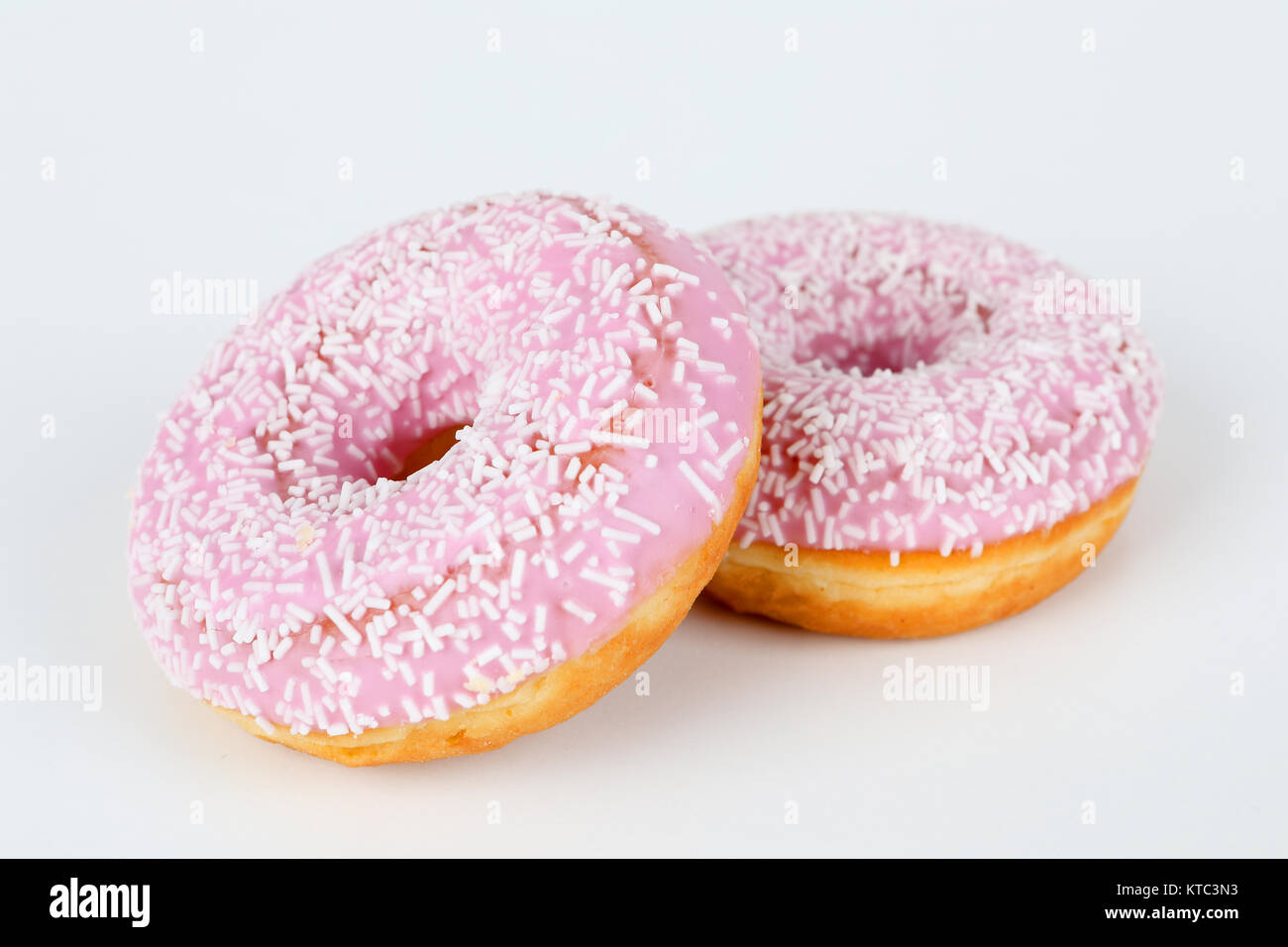 pink doughnut with sprinkles Stock Photo - Alamy