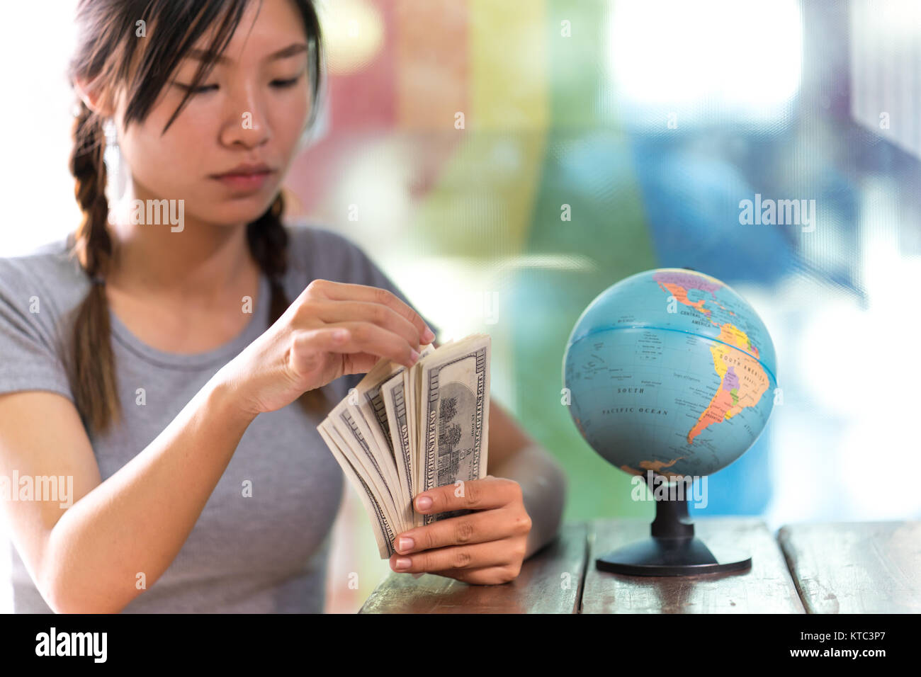 Women explore the globe to plan their trip Stock Photo - Alamy