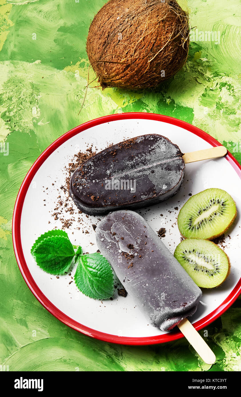 Two ice cream on a stick coated in chocolate Stock Photo - Alamy