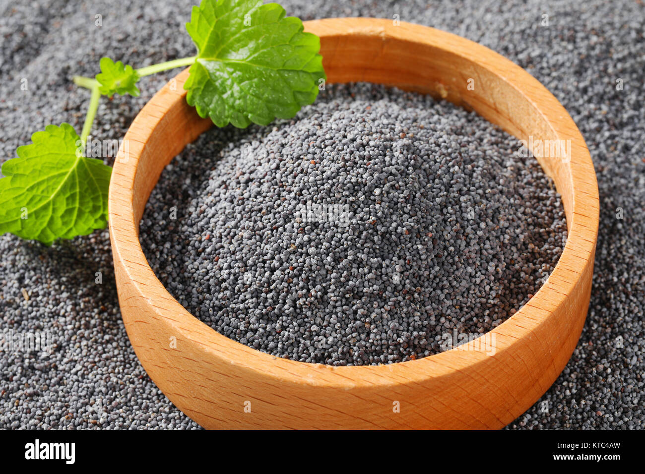 Whole black poppy seeds Stock Photo - Alamy