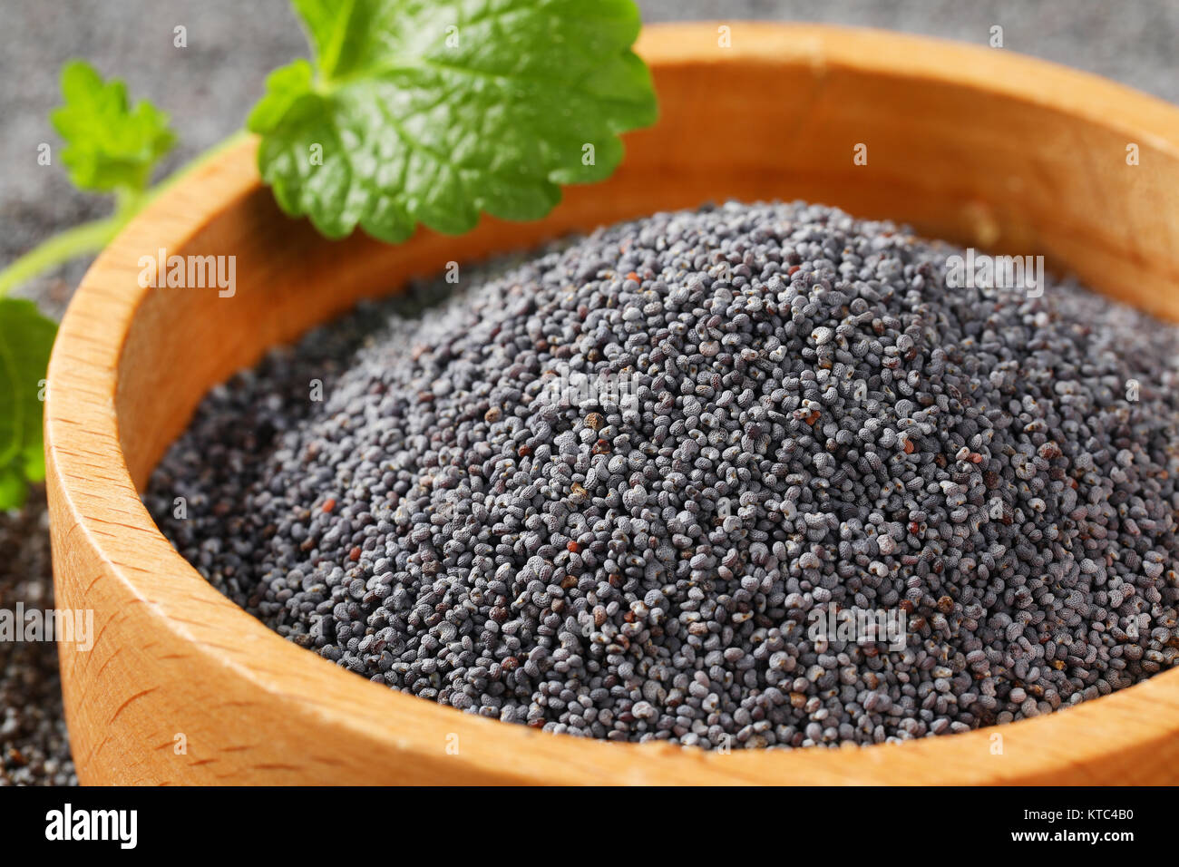 Whole black poppy seeds Stock Photo - Alamy