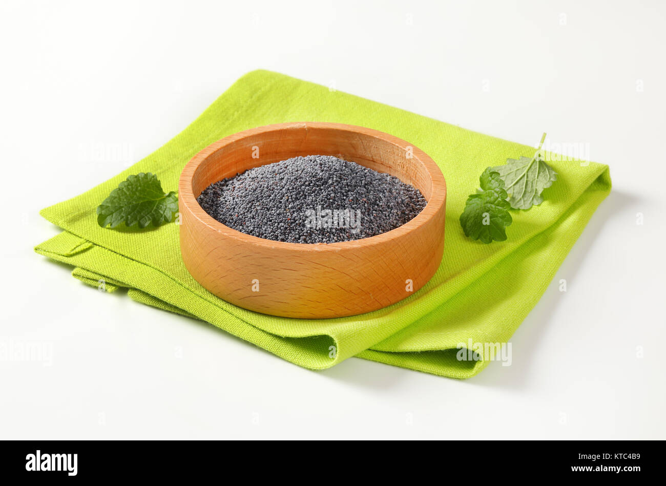 Whole black poppy seeds Stock Photo - Alamy
