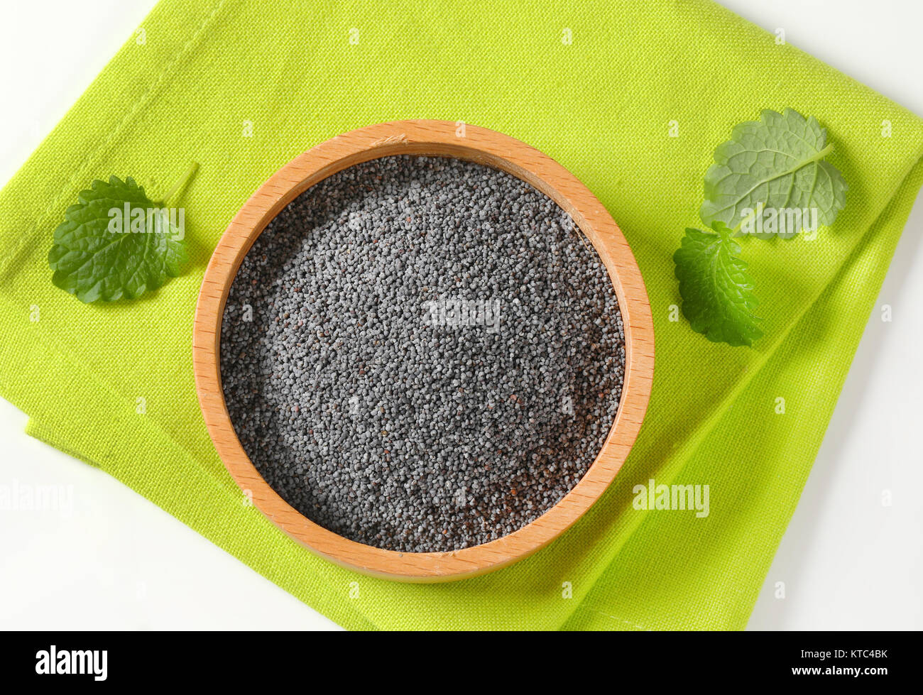 Whole black poppy seeds Stock Photo - Alamy