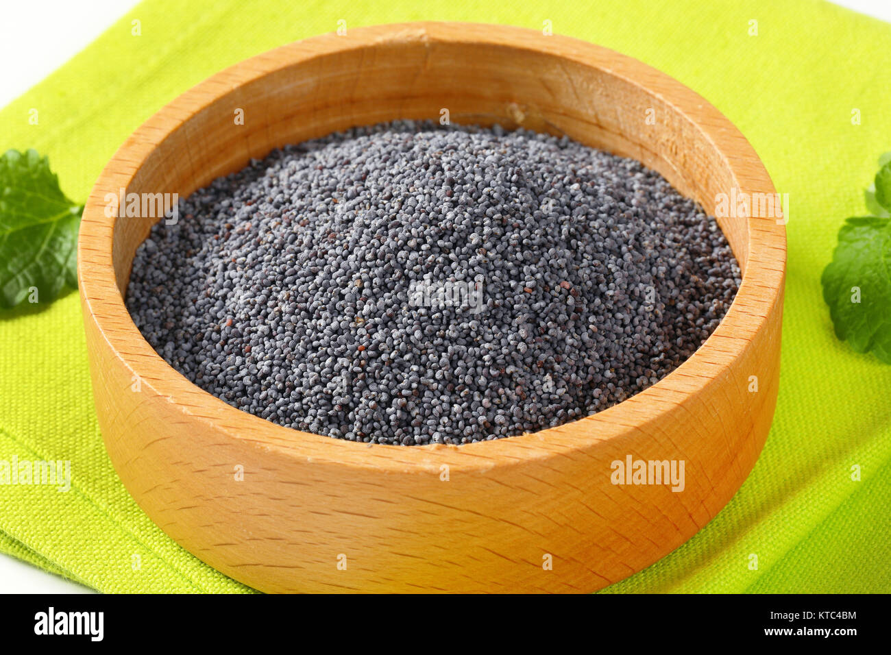 Whole black poppy seeds Stock Photo - Alamy