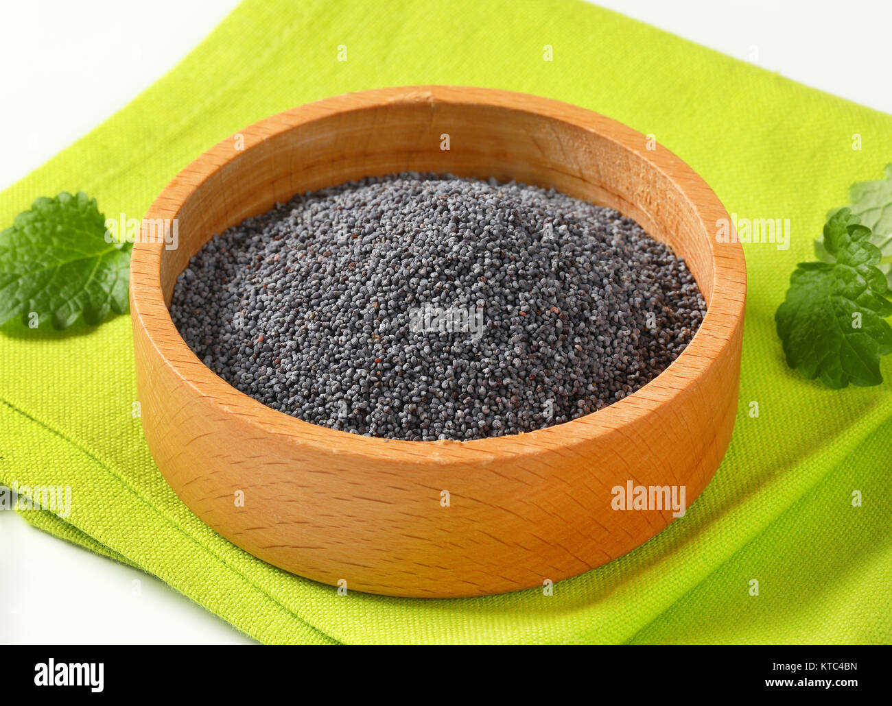 Whole black poppy seeds Stock Photo - Alamy