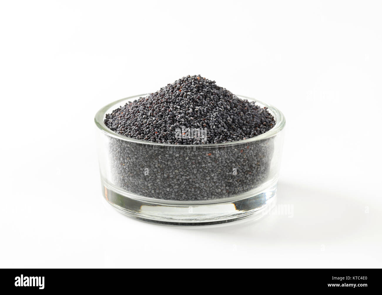 Whole black poppy seeds Stock Photo - Alamy
