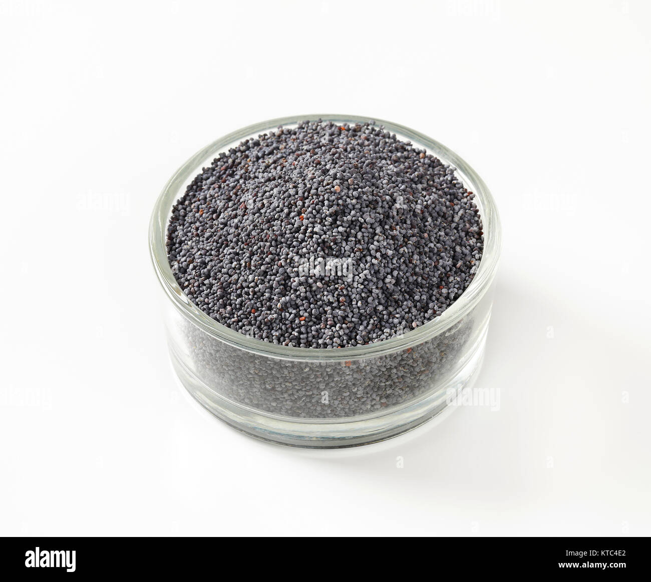 Whole black poppy seeds Stock Photo - Alamy