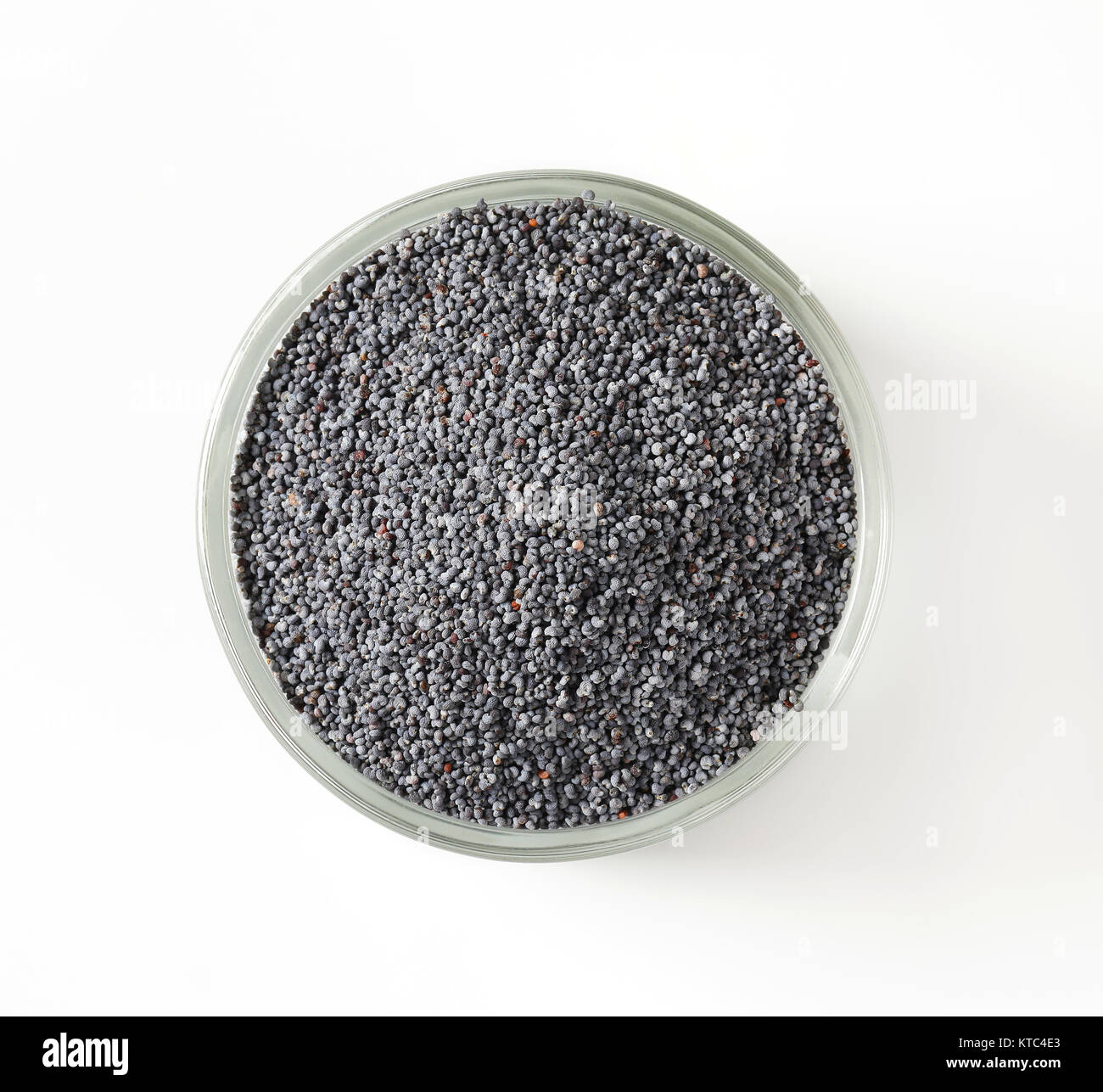 Whole black poppy seeds Stock Photo - Alamy