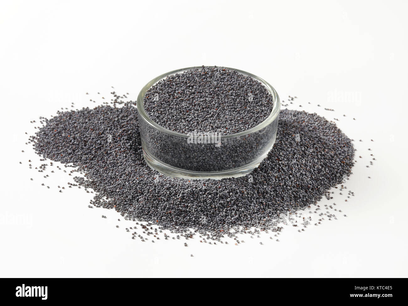 Whole black poppy seeds Stock Photo - Alamy