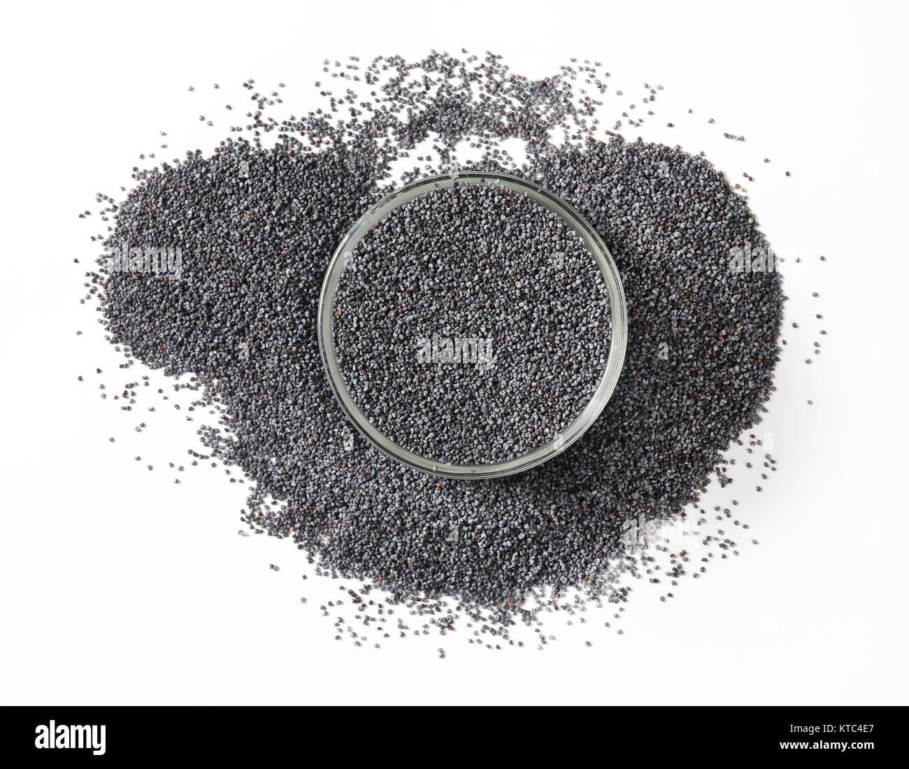 Whole black poppy seeds Stock Photo - Alamy