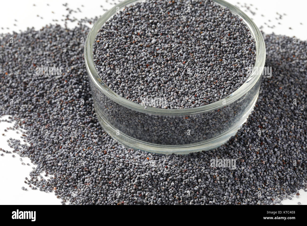 Whole black poppy seeds Stock Photo - Alamy