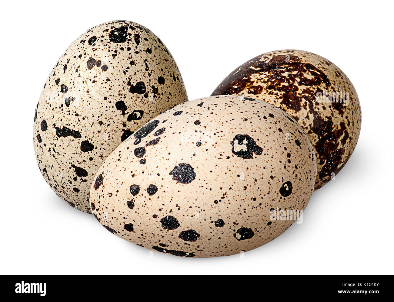 Three quail eggs beside Stock Photo - Alamy