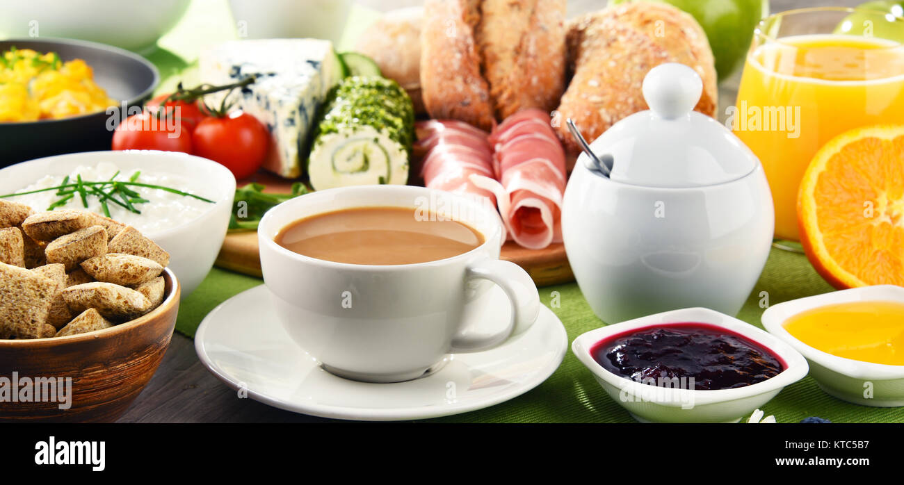 Breakfast served with coffee, cheese, cereals and scrambled eggs Stock ...