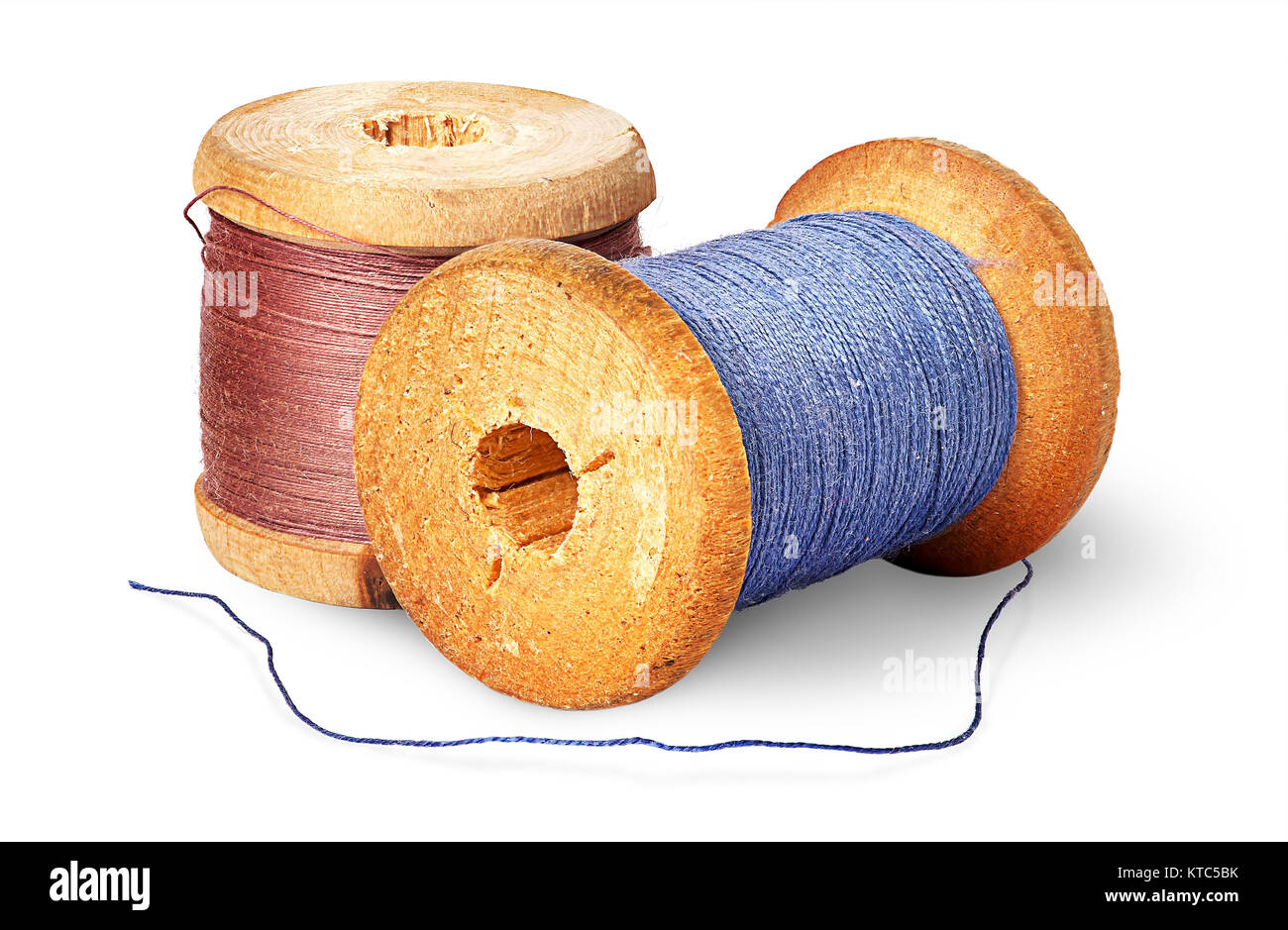 Two different colored thread on wooden spools Stock Photo - Alamy