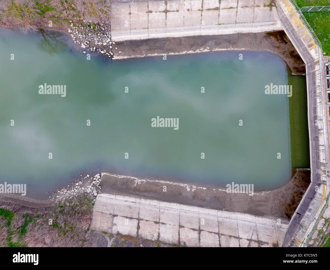 Paved concrete banks of the irrigation canal at the outlet of th Stock ...