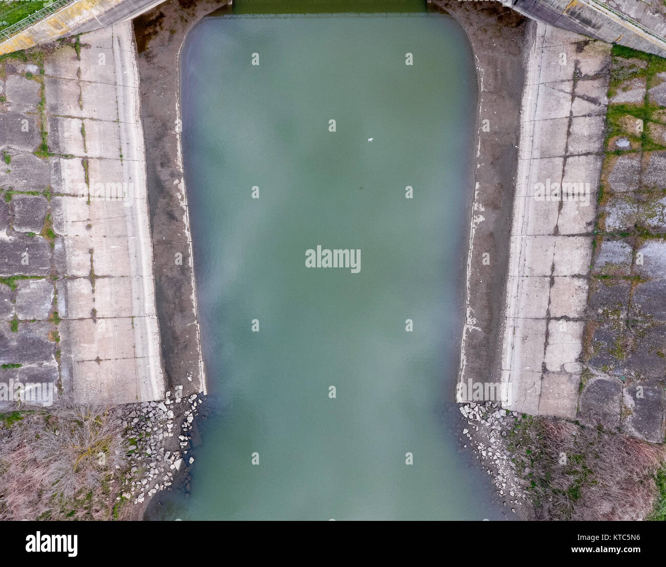 Paved concrete banks of the irrigation canal at the outlet of th Stock ...
