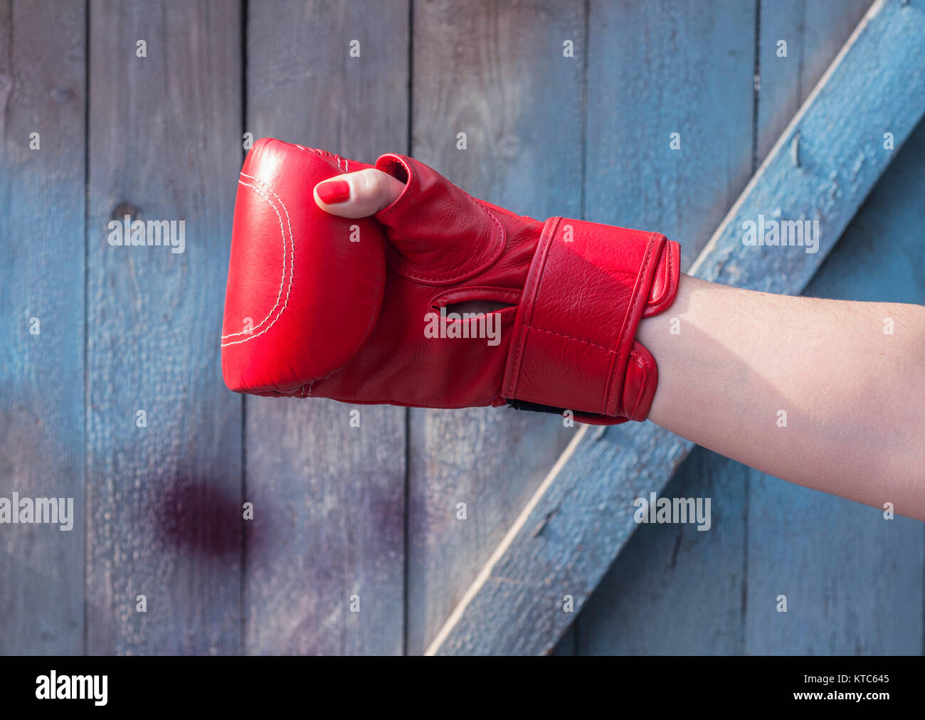 Right hand female in a red boxing glove Stock Photo - Alamy