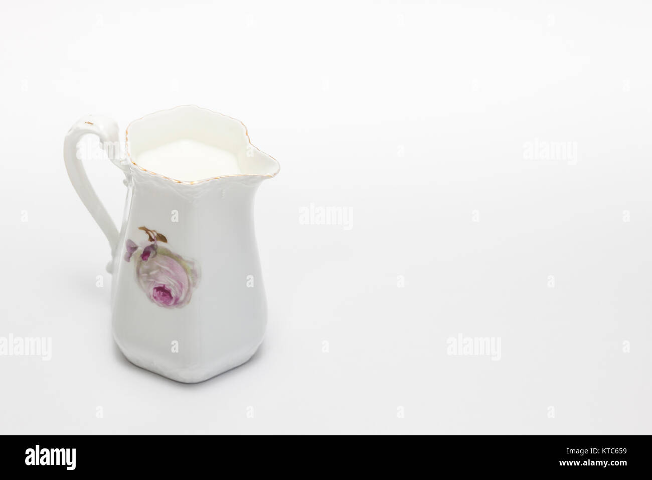 Old grandma's pitcher full of milk Stock Photo - Alamy