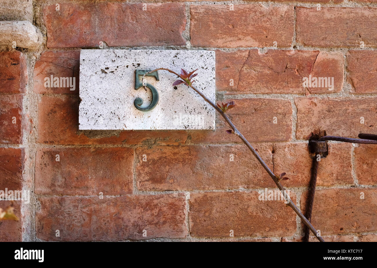 House number on wall Stock Photo - Alamy