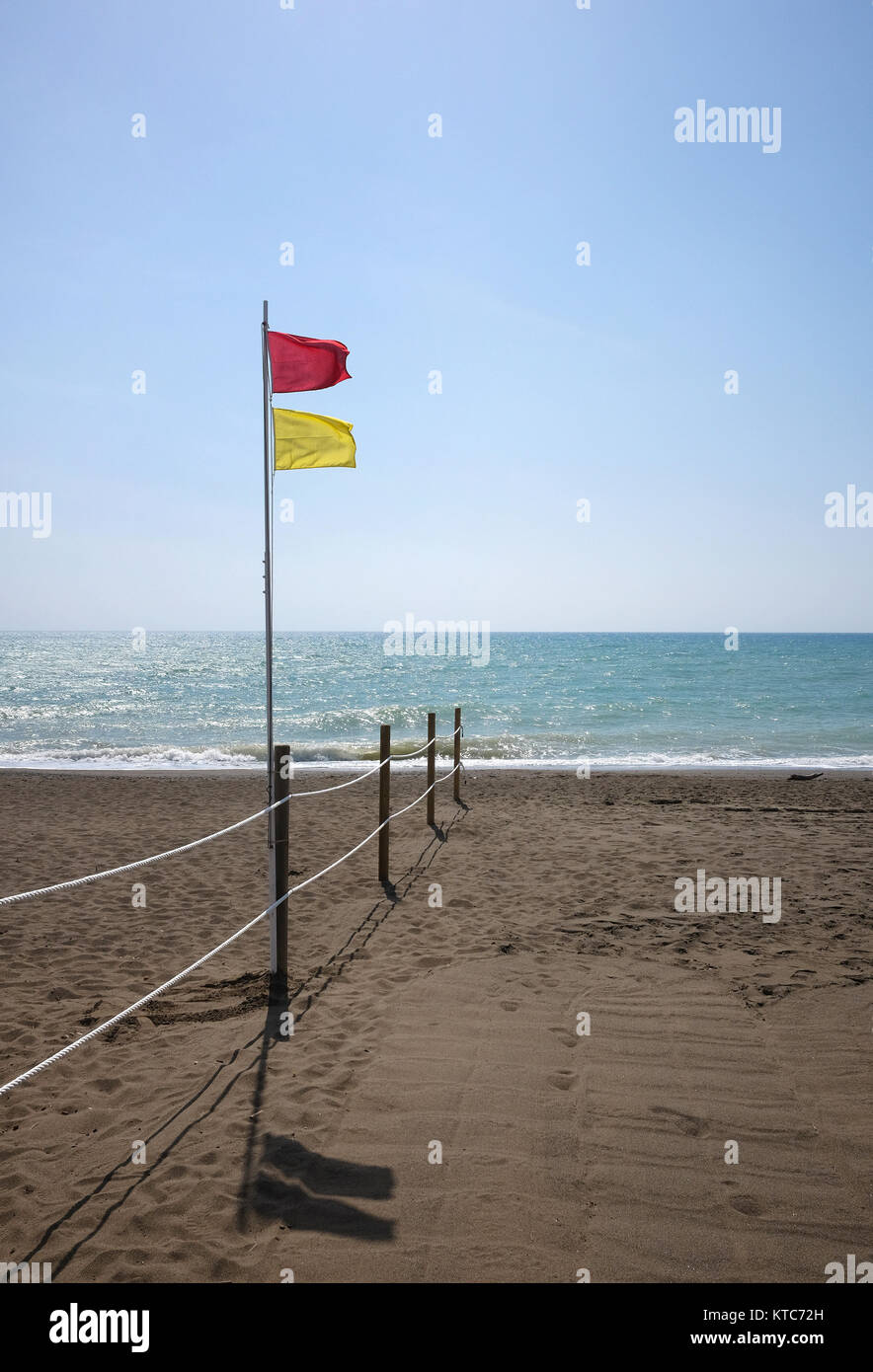 beach fence and safe bathing flag Stock Photo - Alamy