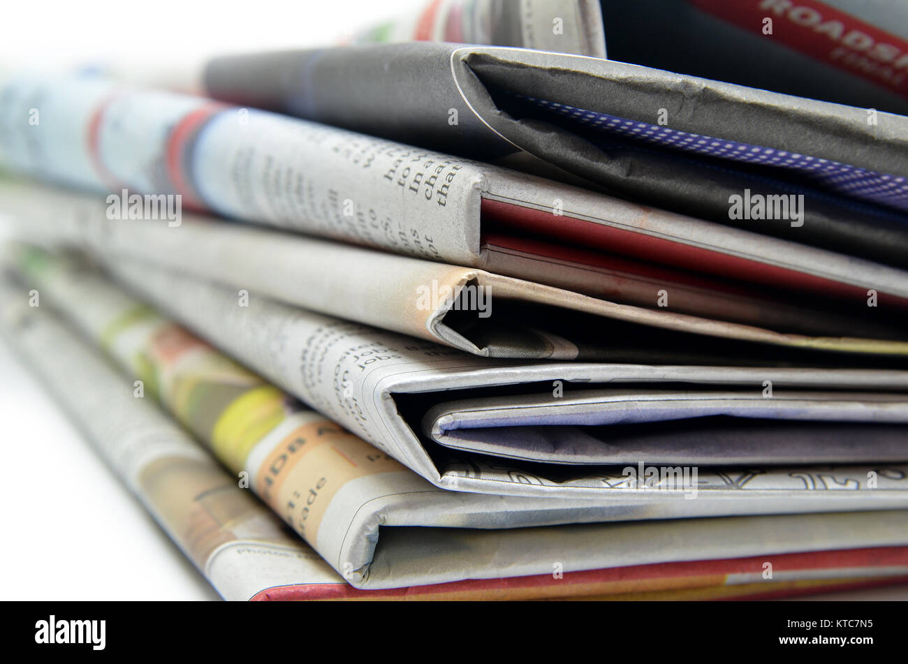Newspapers folded and stacked Stock Photo - Alamy