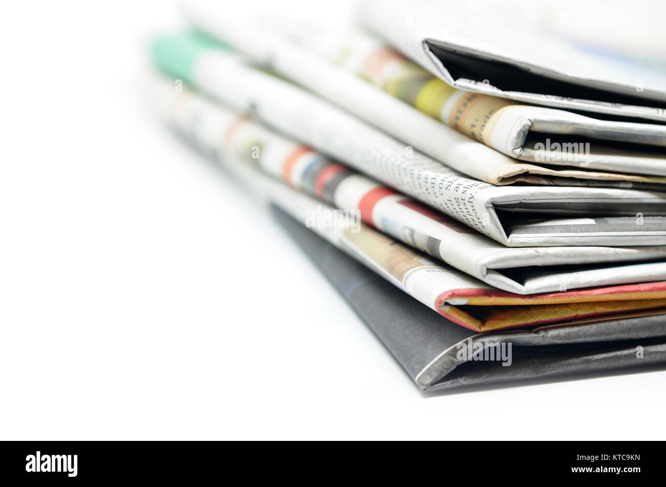 Newspapers folded and stacked Stock Photo - Alamy