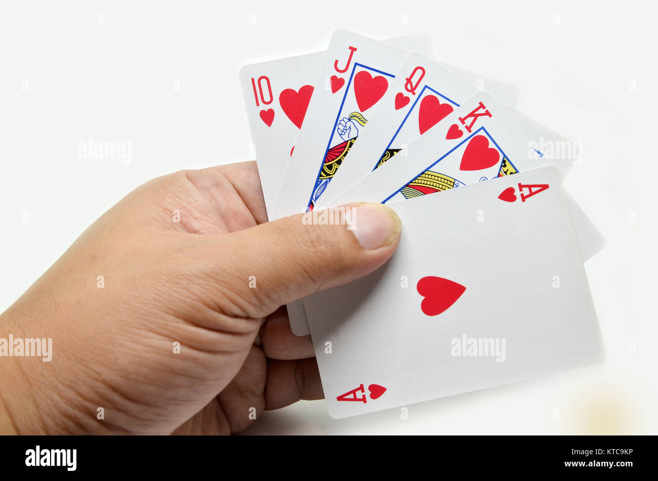 Playing cards in hand Stock Photo - Alamy