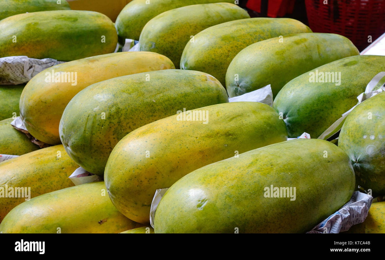 Papaya fresh fruits for sale at the street market in Asia. Close up ...