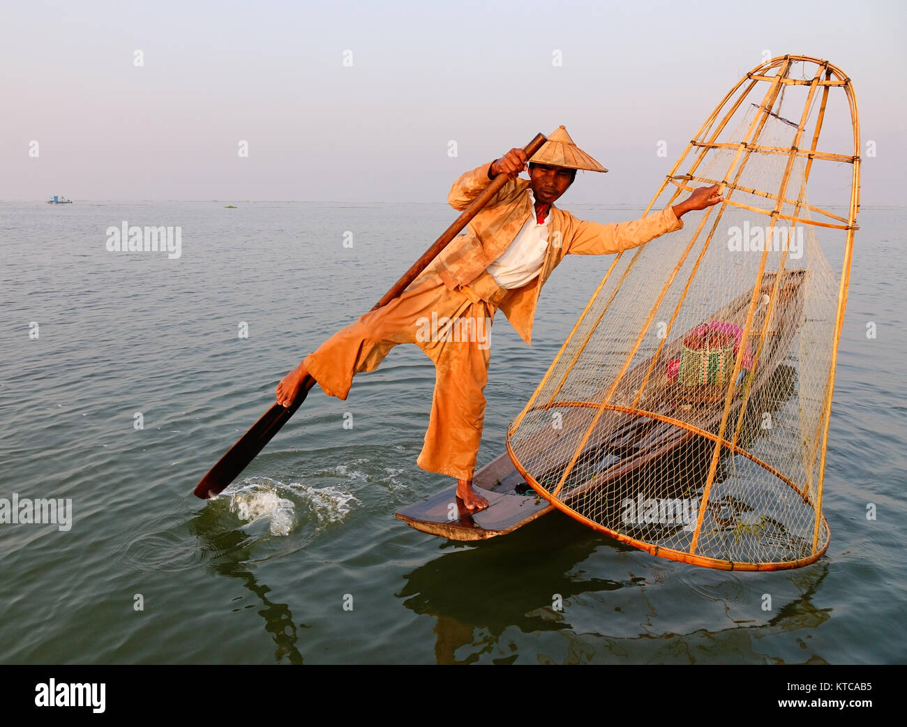 Shan, Myanmar - Feb 16, 2016. A fisherman catching fish on Inle Lake in ...