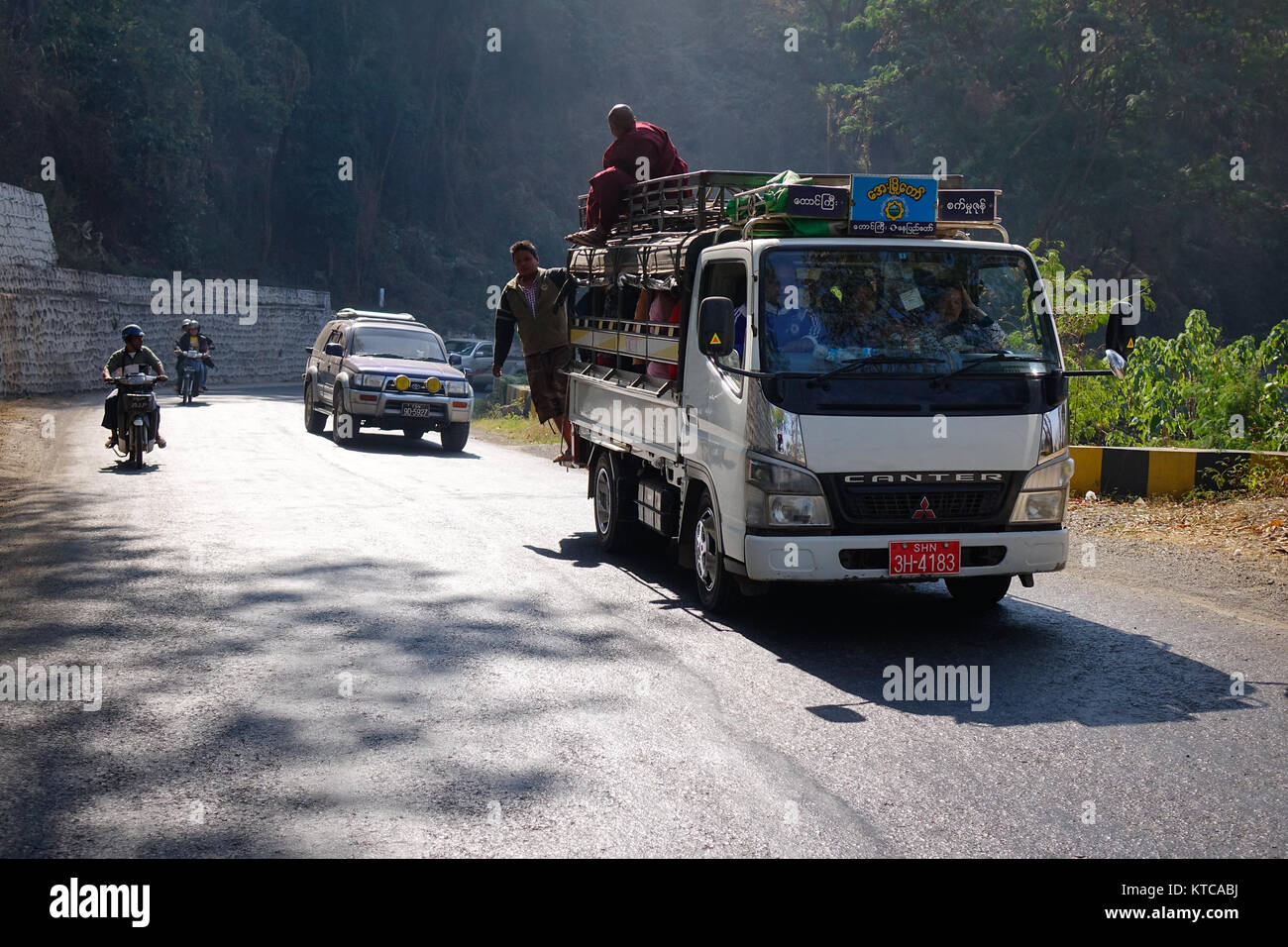 Mandalay, Myanmar - Feb 16, 2016. A local bus running on rural road in ...