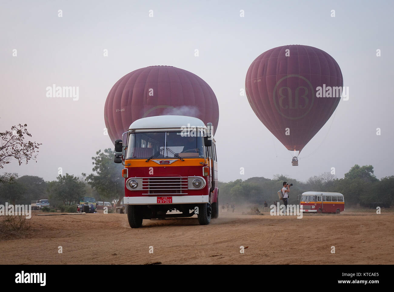 Bagan, Myanmar - Feb 20, 2016. Tourist buses at hot air balloon site in ...