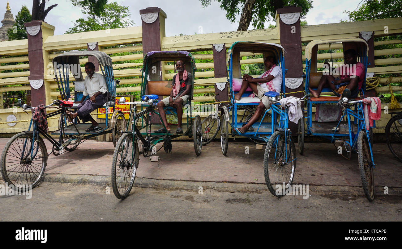 Kolkata, India - Jul 9, 2015. Rickshaw drivers waiting on street in ...